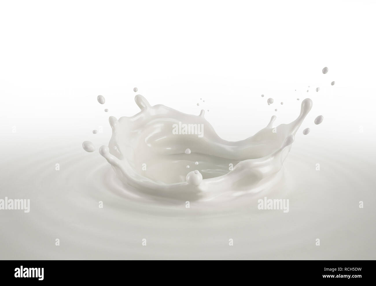 Milk crown splash, splashing in milk pool with ripples. Bird eye view ...