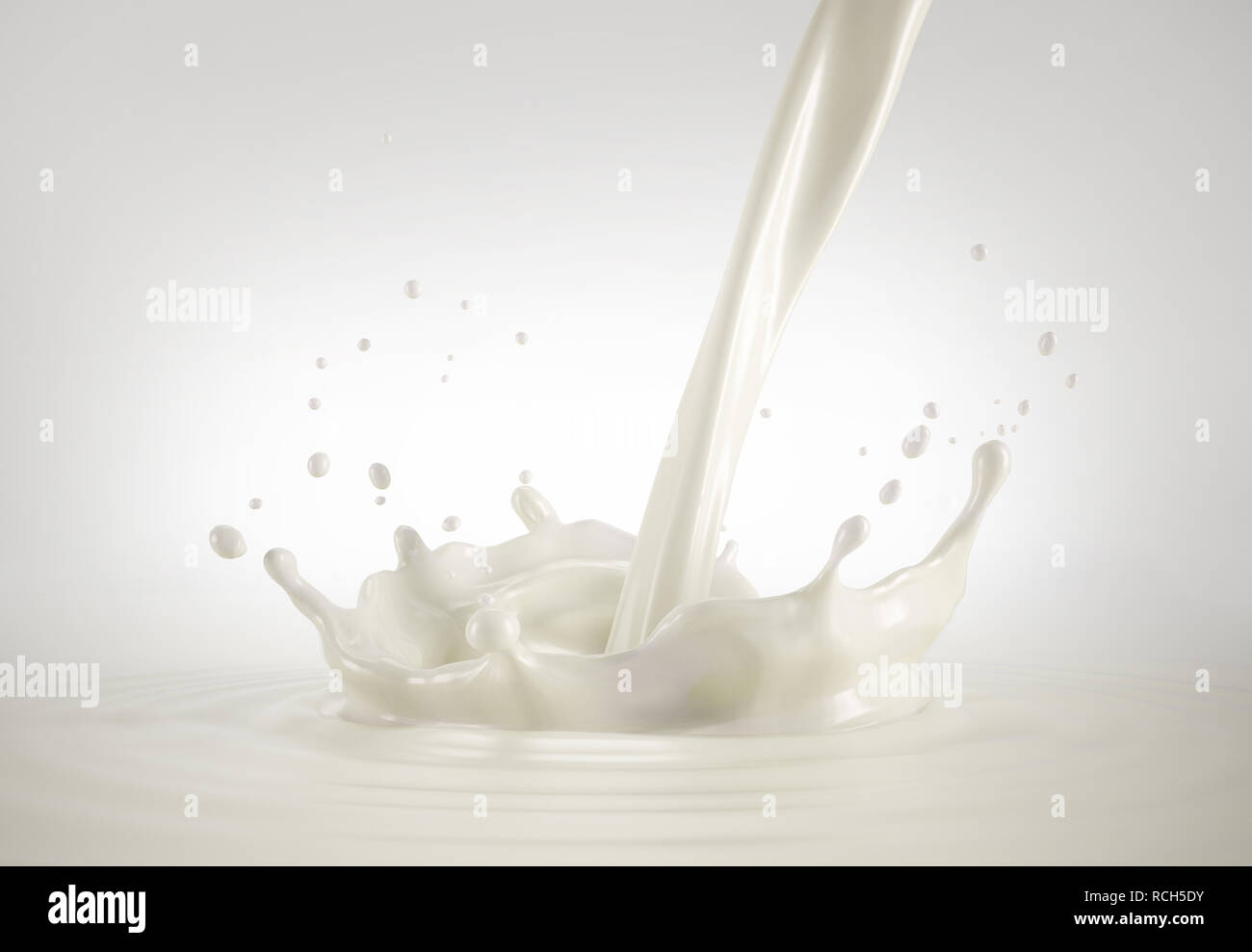 Milk pour withcrown splash n milk pool with ripples. Bird eye view. On ...