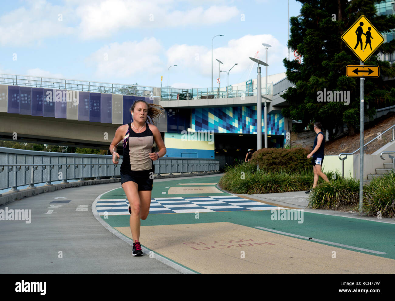 Woman running alongside river hi-res stock photography and images - Alamy