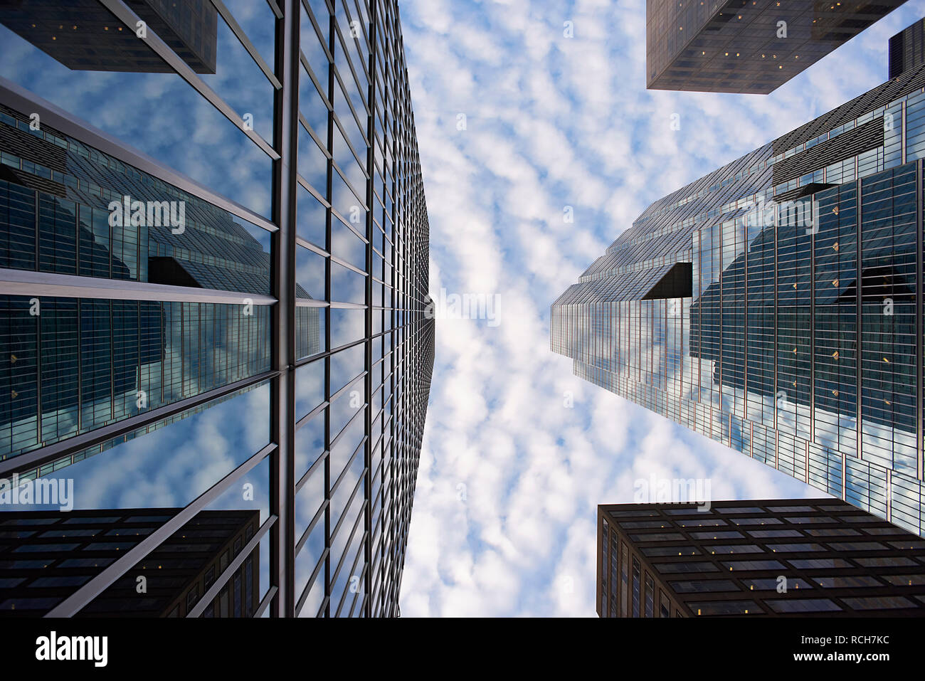 Amazing symetrical low angle shot looking up to the skyscrapers in the ...