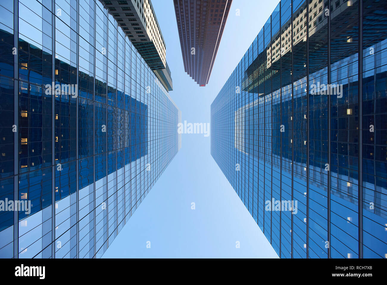 Amazing symetrical low angle shot looking up to the skyscrapers in the ...
