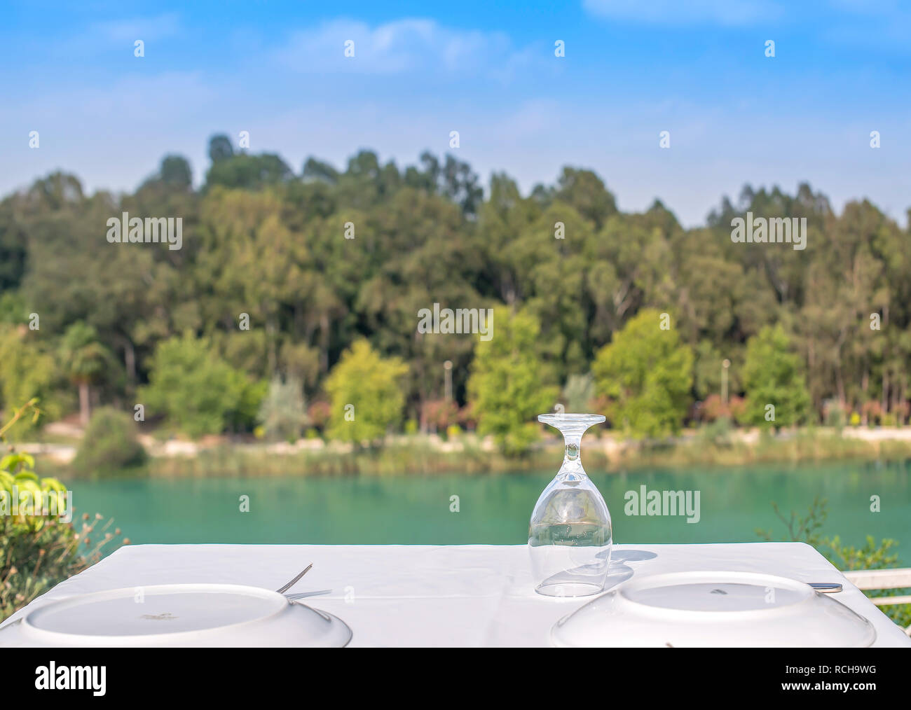 Restaurant table at the river and trees. This is Outdoor dining table ...