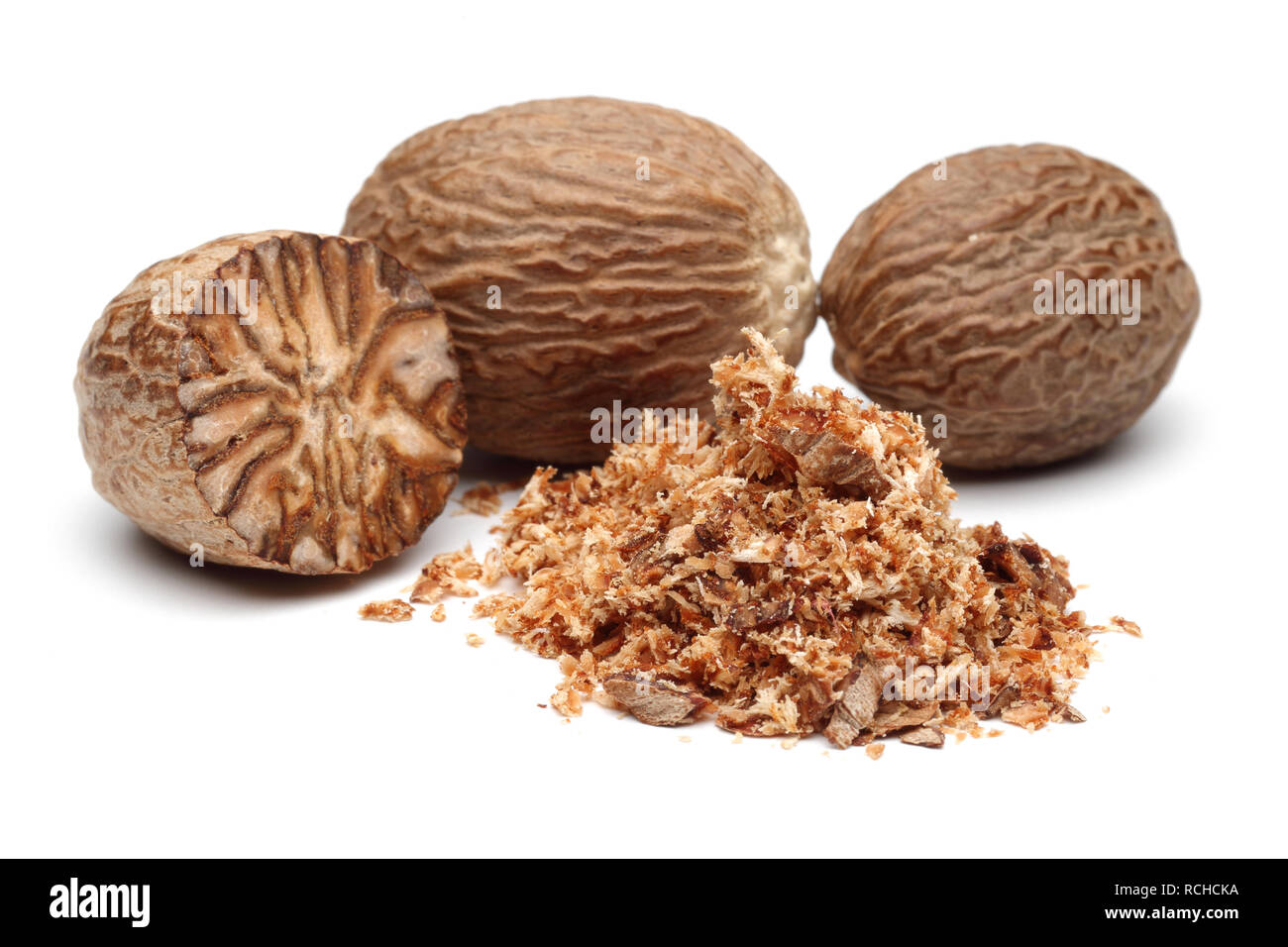 Nutmeg and nutmeg granules isolated on white background Stock Photo - Alamy