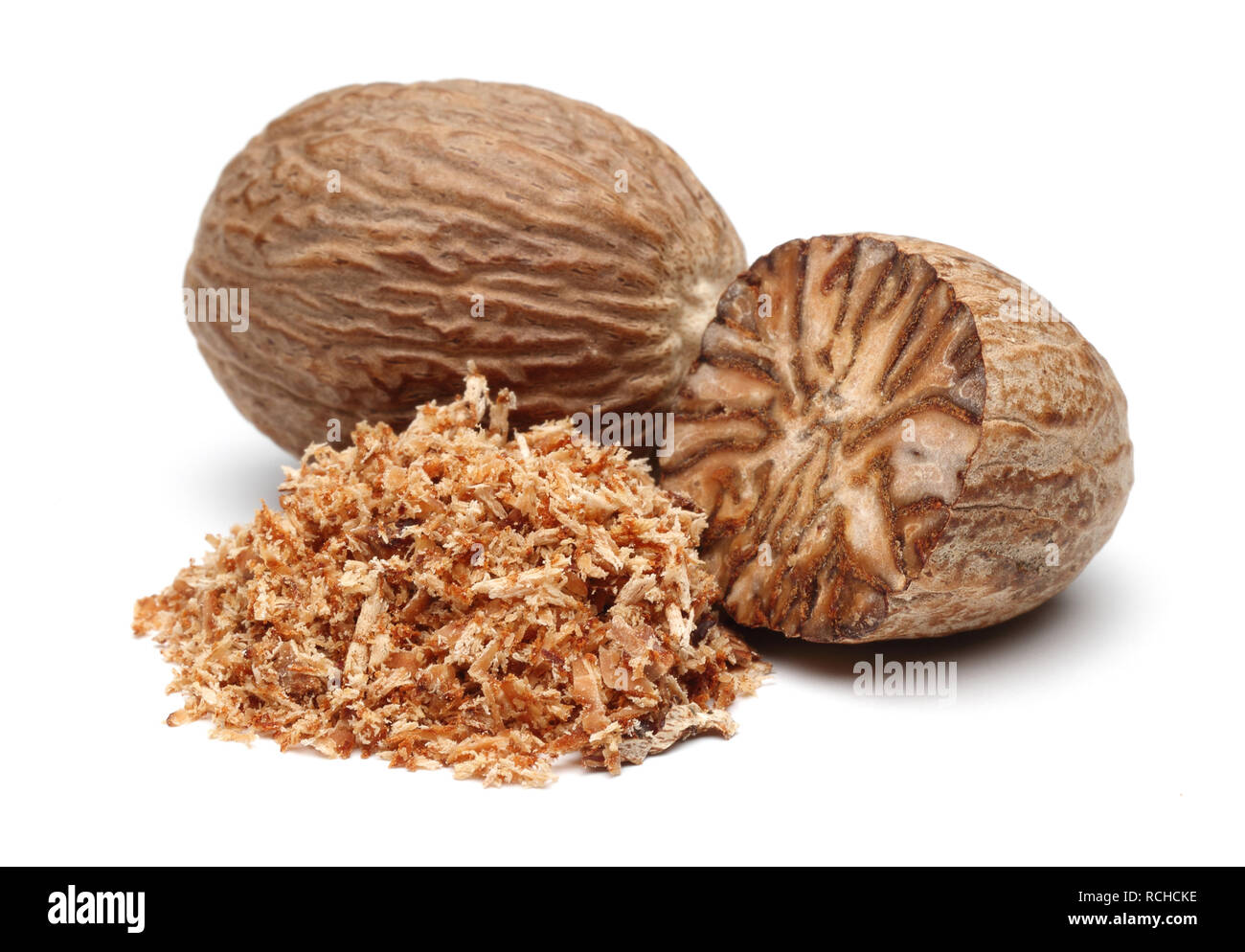 Nutmeg and nutmeg granules isolated on white background Stock Photo - Alamy