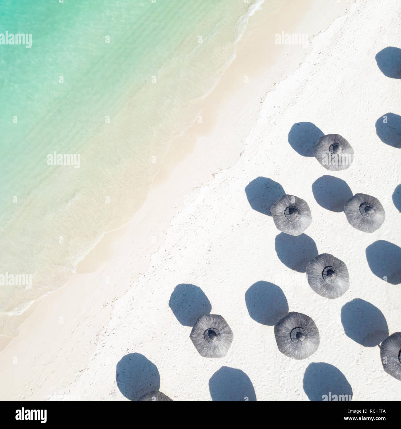 Aerial view of amazing tropical white sandy beach with palm leaves ...