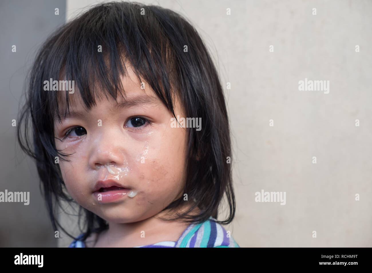 Emotional scene. Portrait of crying baby asian girl Stock Photo - Alamy