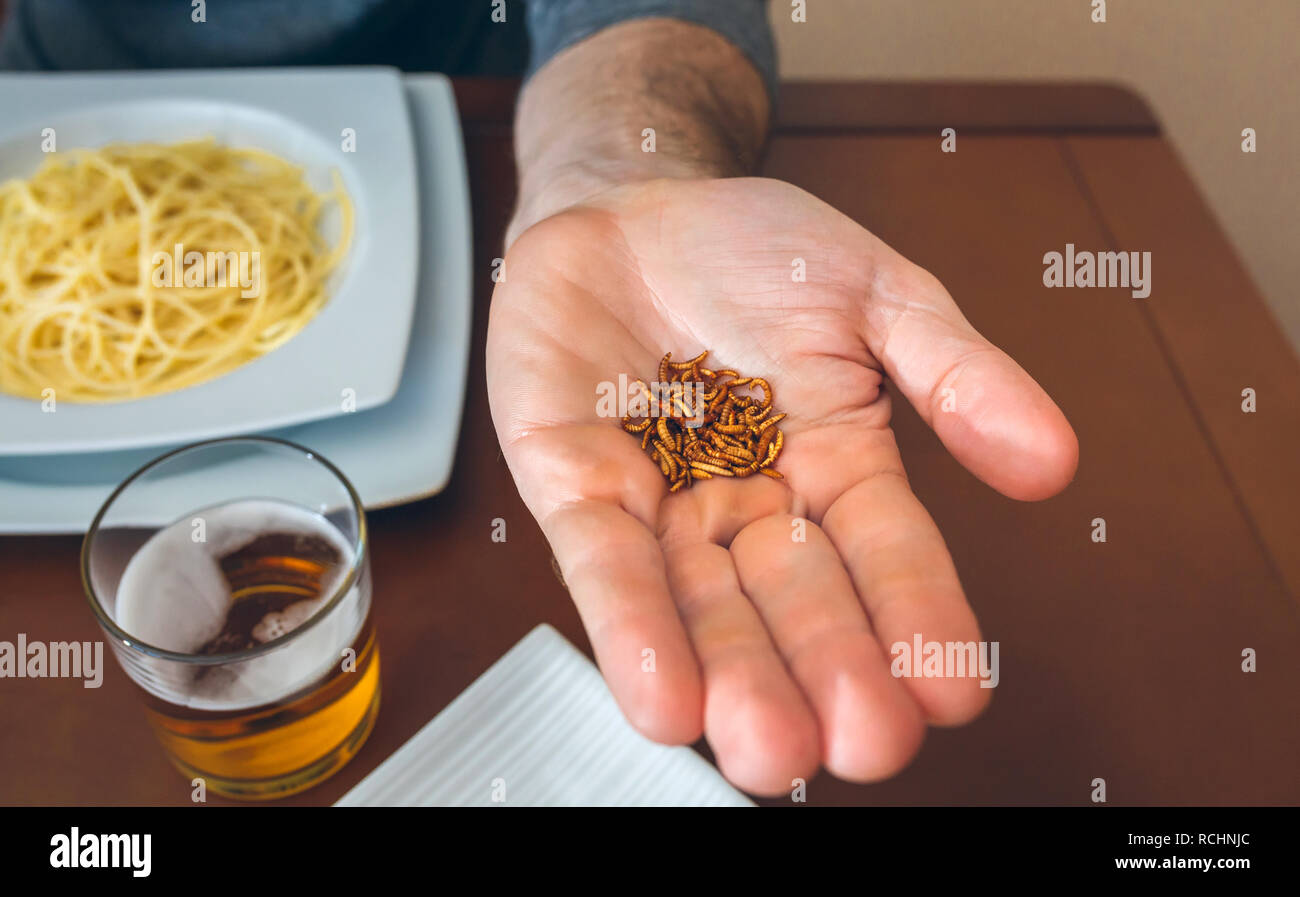 Man showing a handful of worms Stock Photo - Alamy
