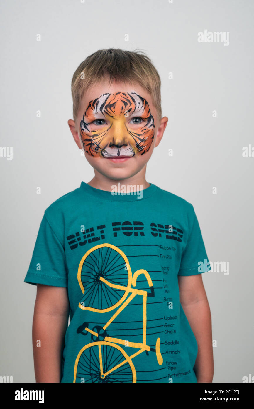 Happy boy with tiger face hi-res stock photography and images - Alamy