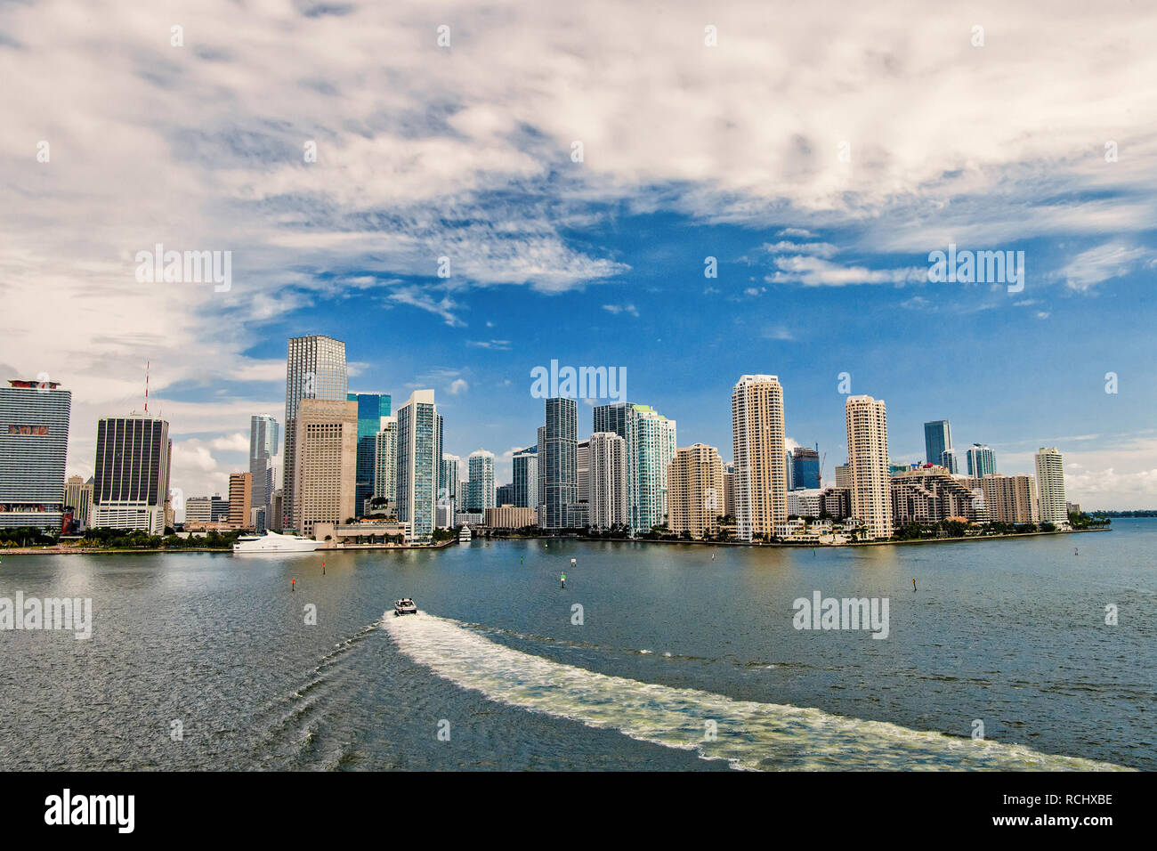 Miami skyline skyscrapers ,yacht or boat sailing next to Miami downtown ...