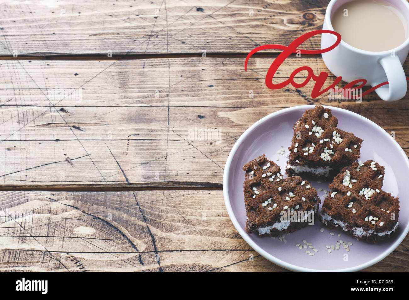 Concept Valentine's Day. Cup of coffee and cookies on a wooden table ...