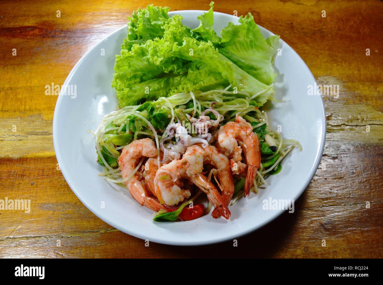 sunflower sprout with mixed seafood spicy salad on dish Stock Photo - Alamy