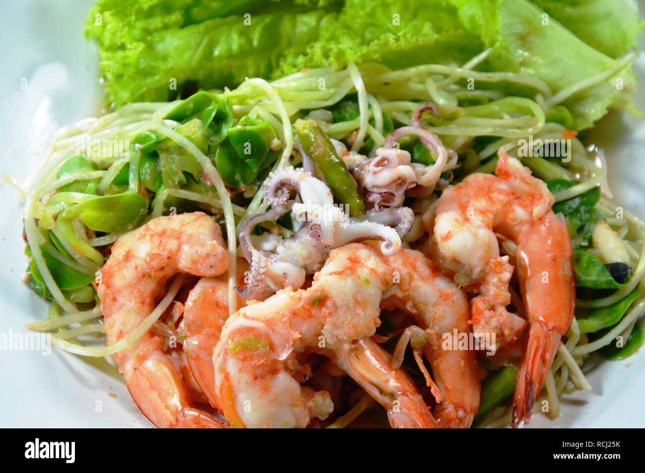sunflower sprout with mixed seafood spicy salad on dish Stock Photo - Alamy