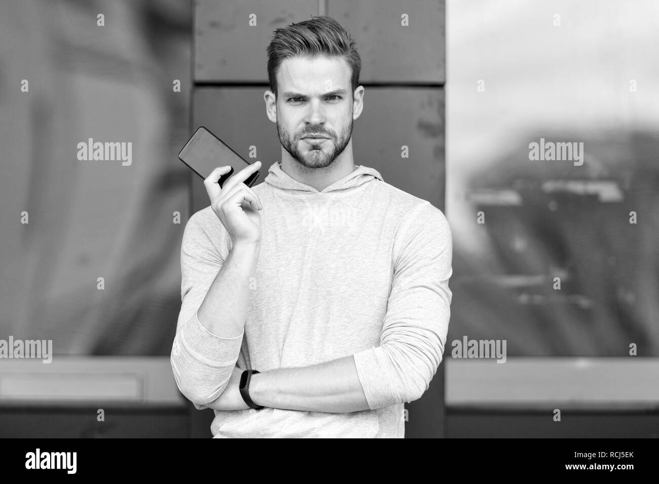 Man serious face holds Black and White Stock Photos & Images - Alamy