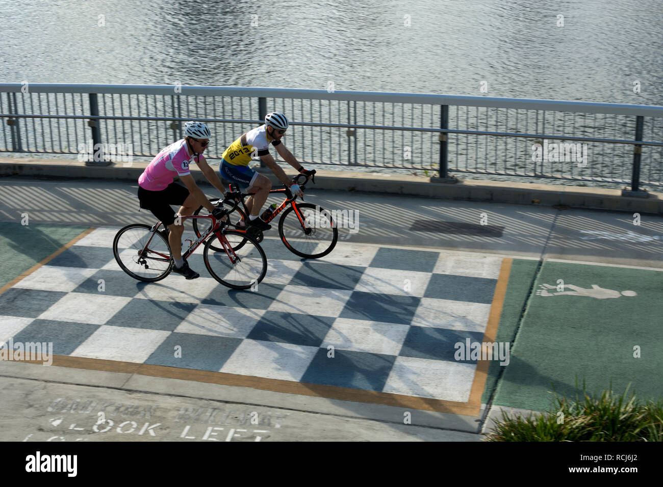 Two cyclists on the riverside cycleway and walkway, Brisbane ...