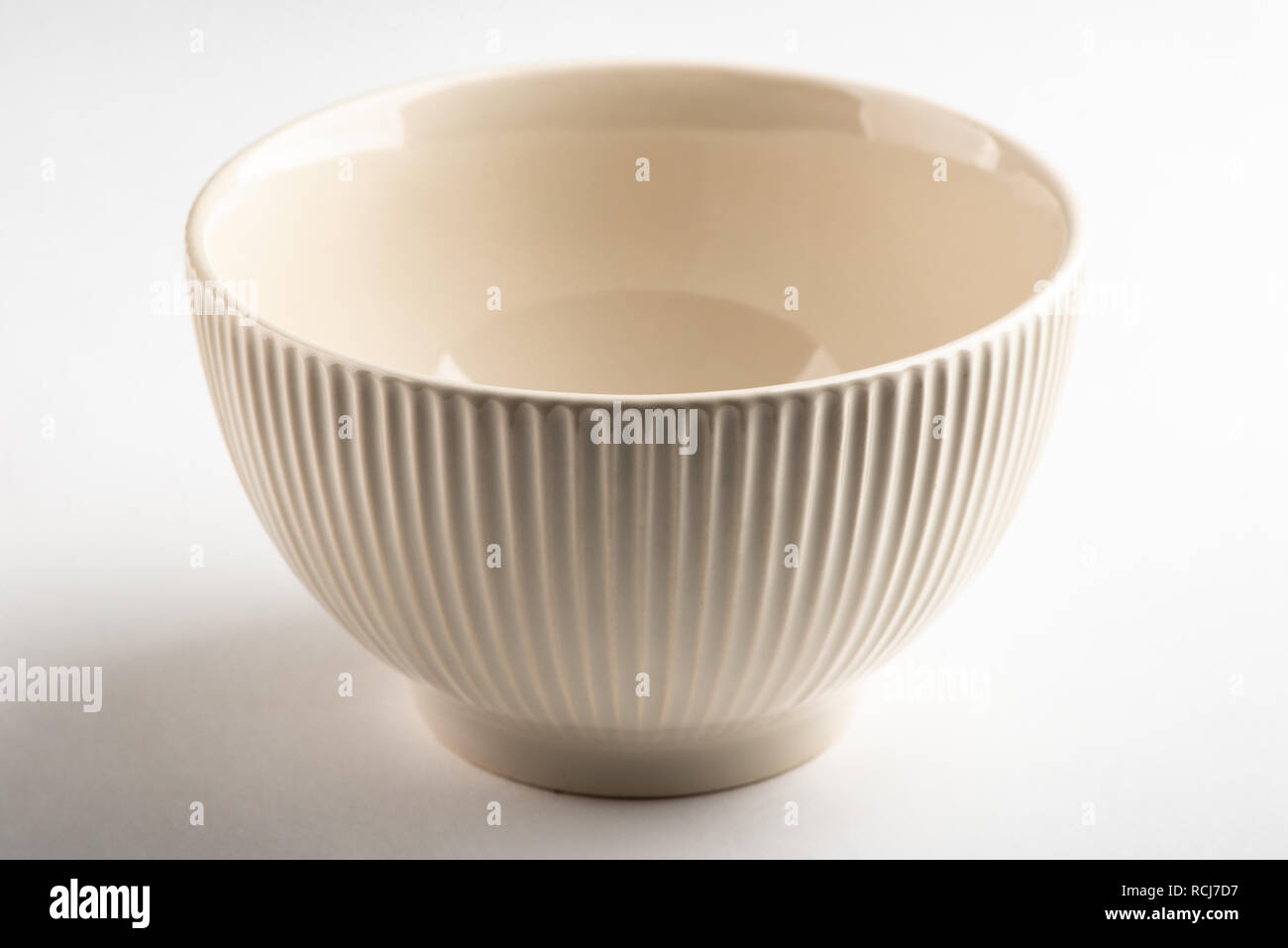 Ribbed beige mixing bowl Stock Photo - Alamy