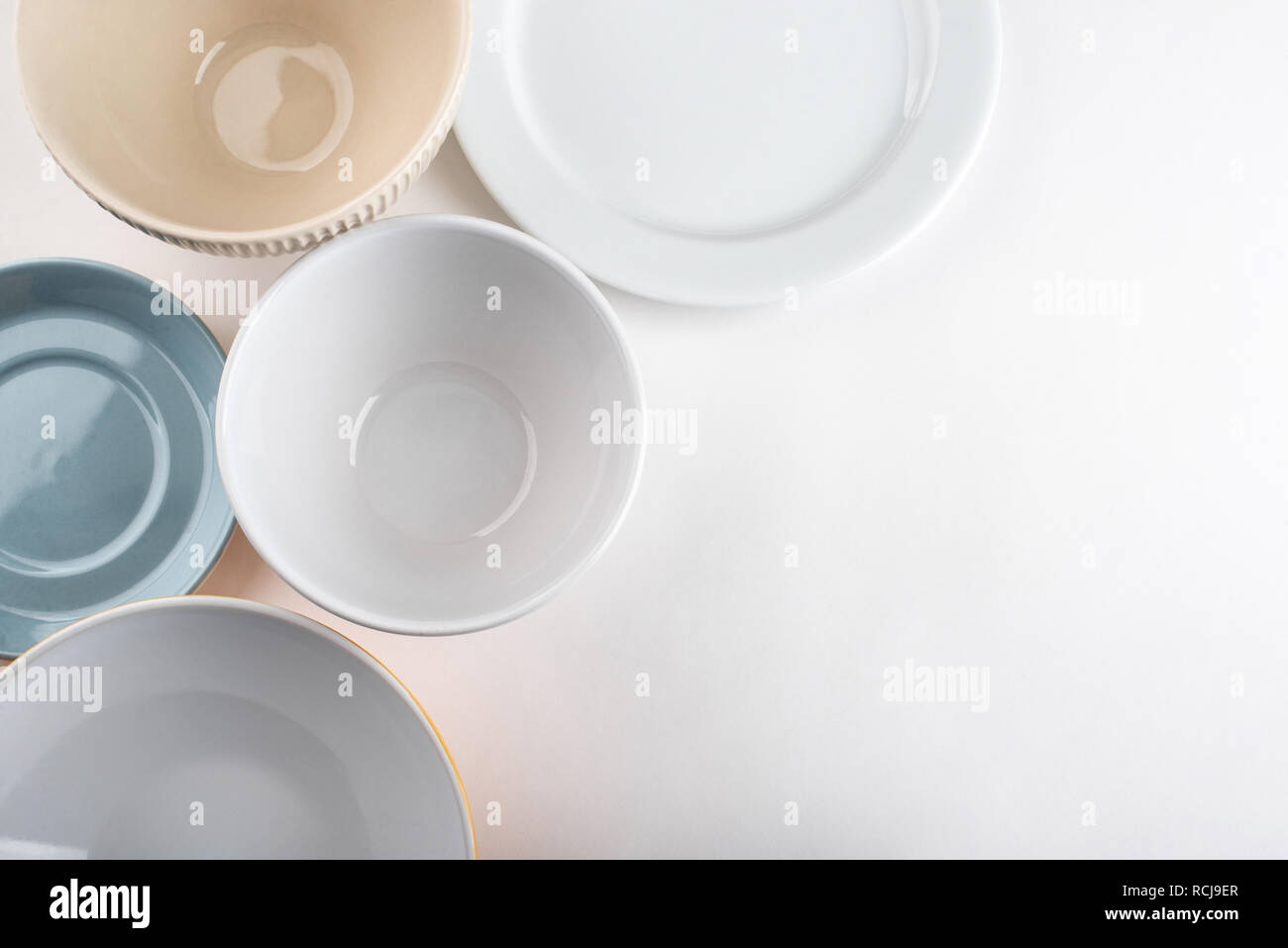 Assorted dishware on white background Stock Photo - Alamy