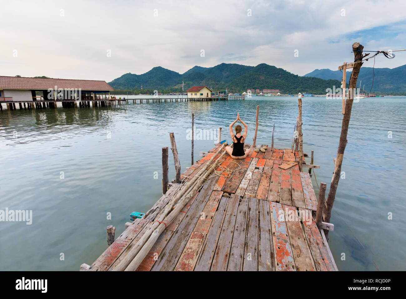 Summer yoga session on a pier - Koh Chang Bang Bao fisherman village ...