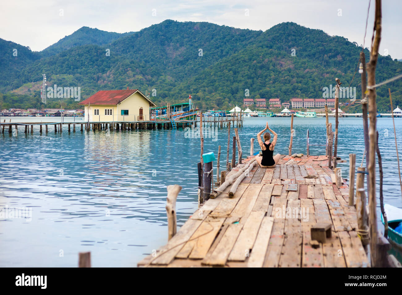 Summer yoga session on a pier - Koh Chang Bang Bao fisherman village ...