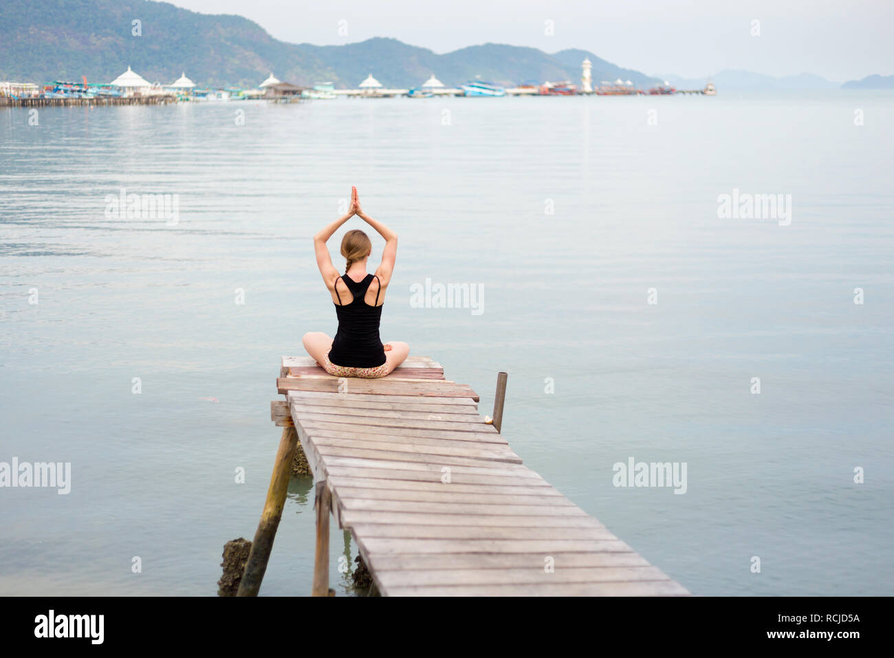 Summer yoga session on a pier - Koh Chang Bang Bao fisherman village ...