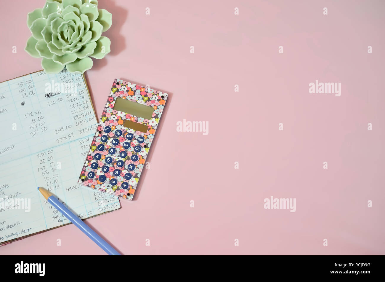 Checkbook with Calculator on Pink Background Stock Photo - Alamy