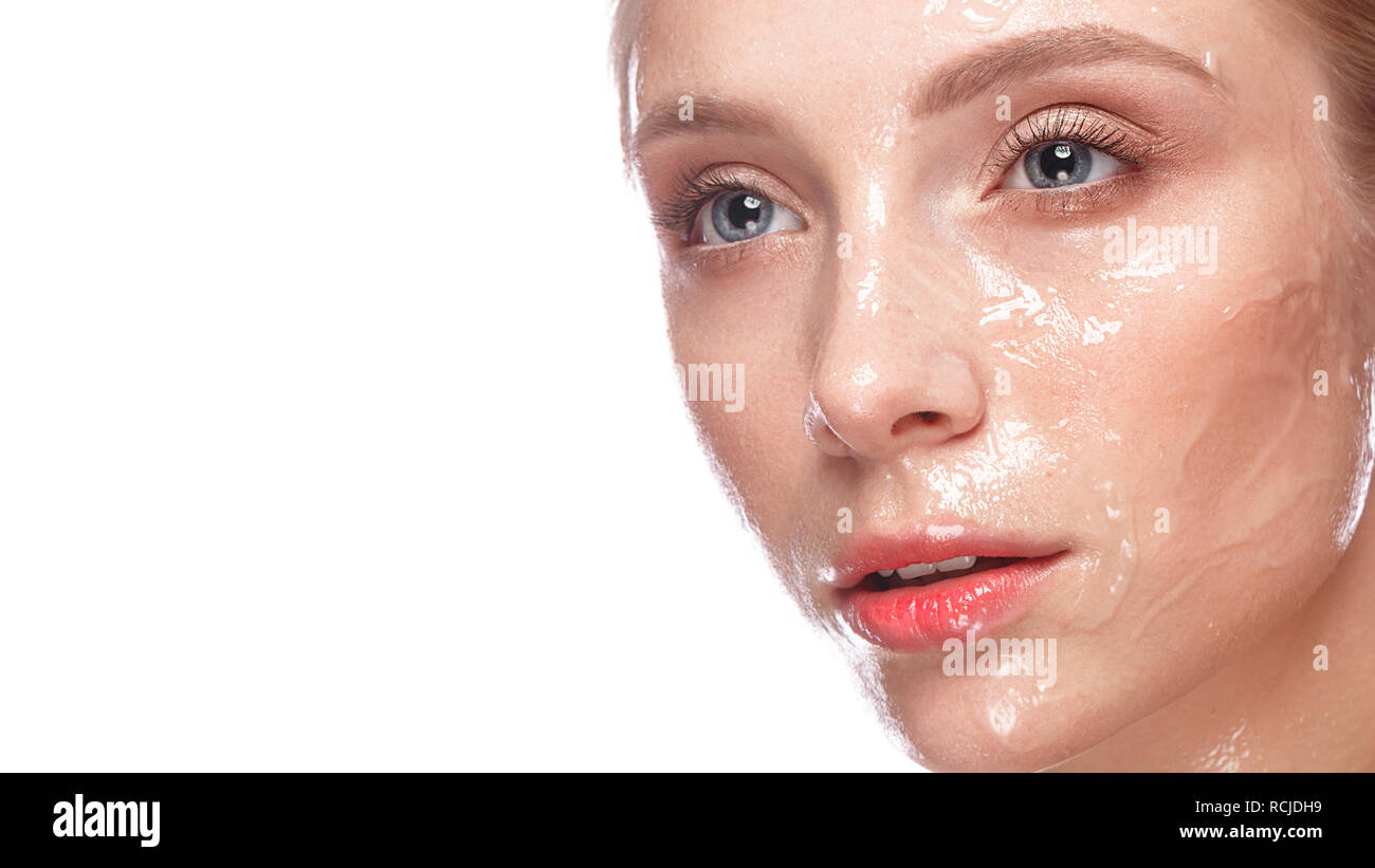 Beautiful young girl with a light natural make-up and perfect wet skin ...
