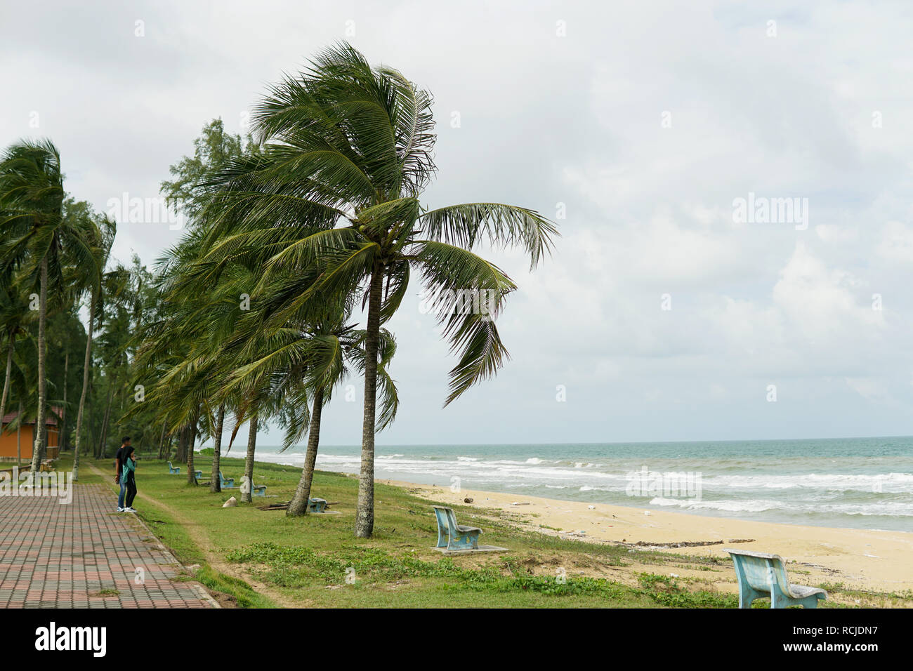 Beach and Seaview with happy couple standing on a beach side in ...
