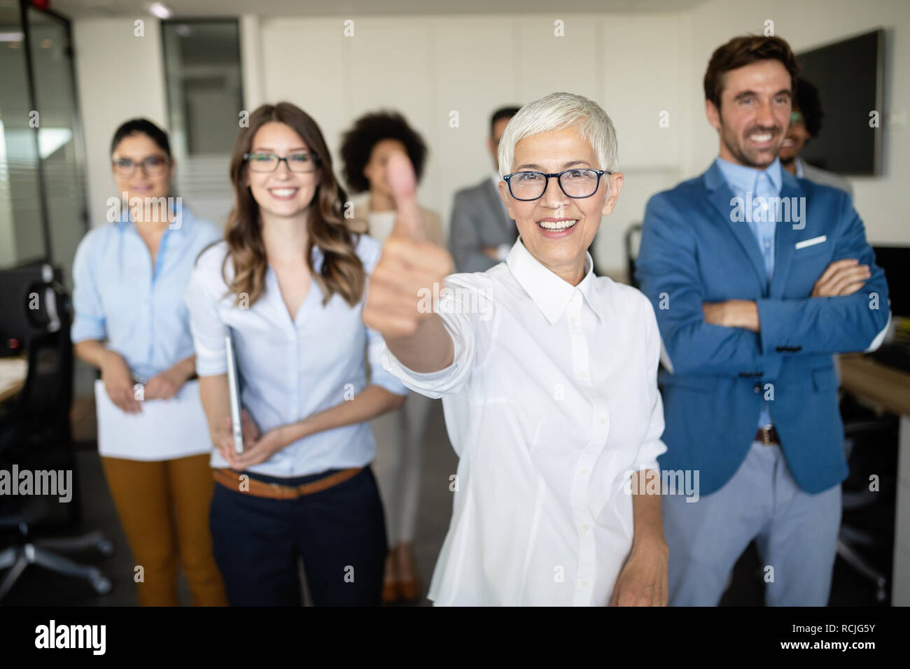 Business team celebrating a good job in the office Stock Photo - Alamy