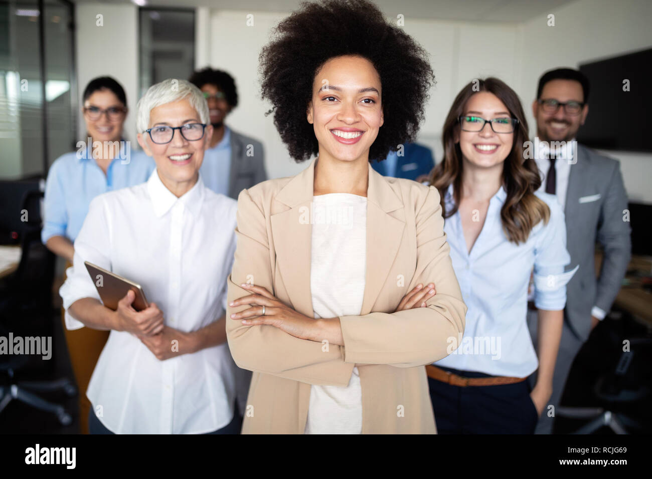 Successful company with happy workers in office Stock Photo - Alamy