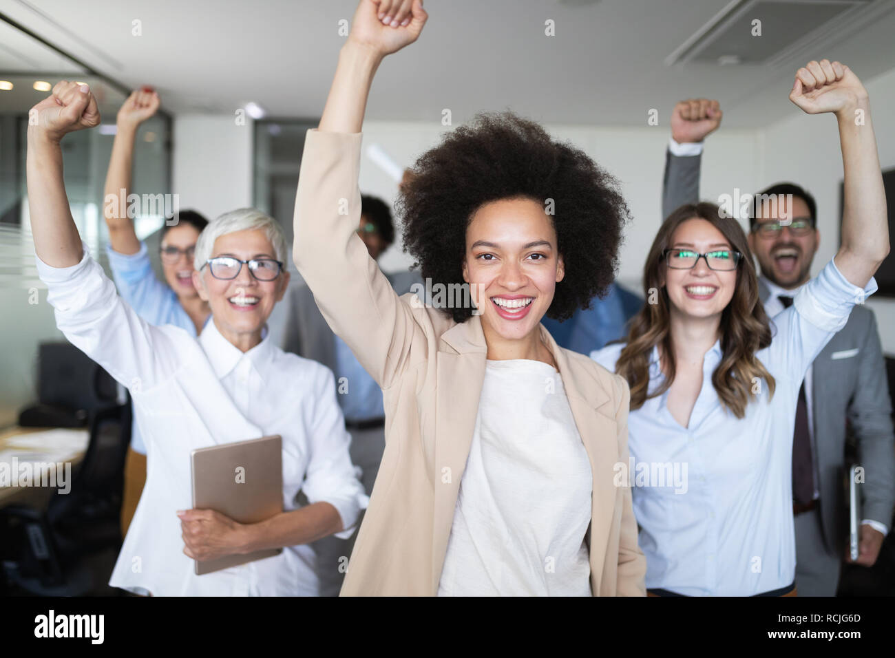 Business team celebrating a good job in the office Stock Photo - Alamy