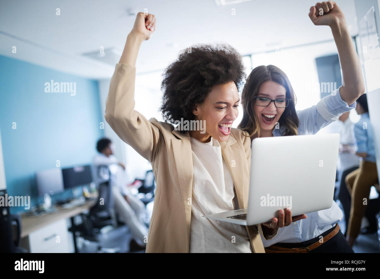 Business team celebrating a good job in the office Stock Photo - Alamy