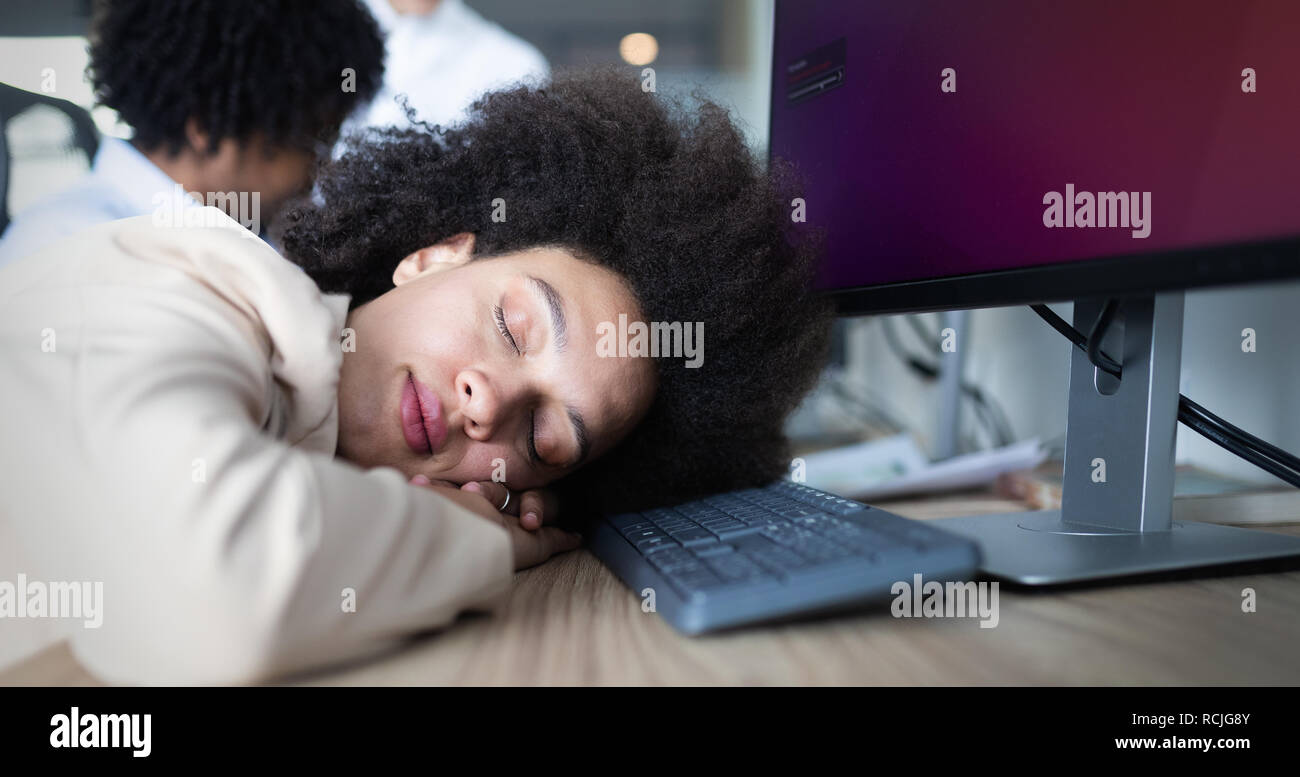 Portrait of an exhausted business woman sleeping at work Stock Photo ...