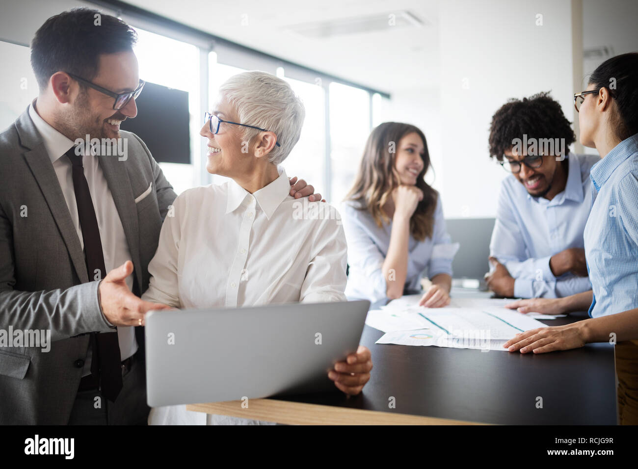 Creative business people working on business project in office Stock ...