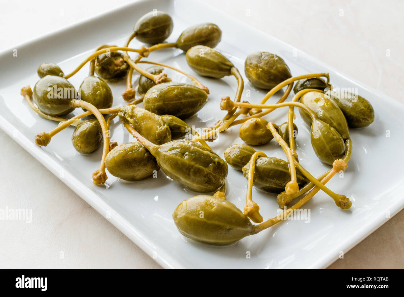 Pickled and Canned Capers Ready to Eat in Plate. Organic Food Stock ...