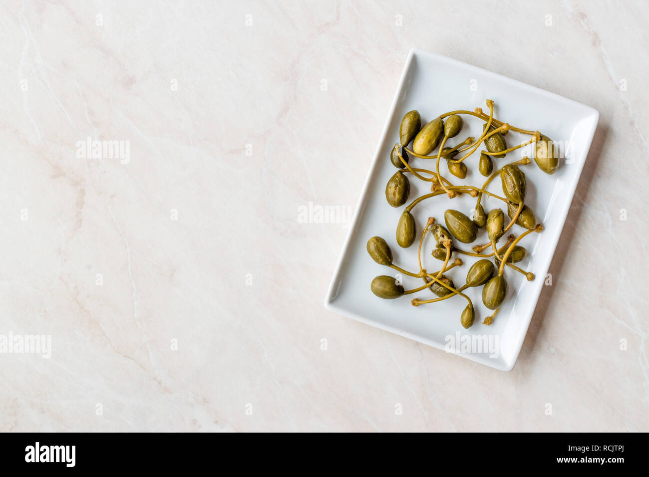 Pickled and Canned Capers Ready to Eat in Plate. Organic Food Stock ...