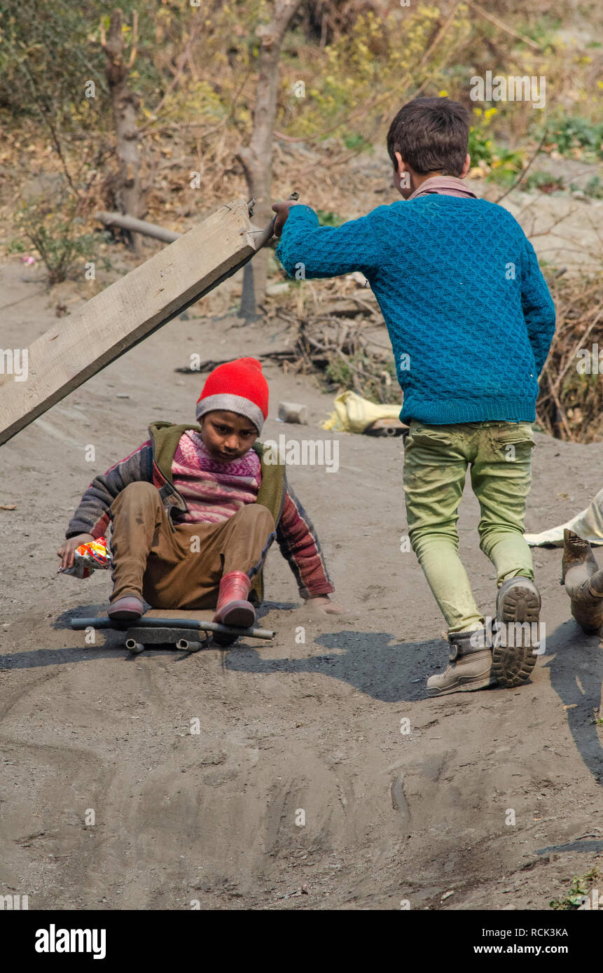 Children sledding down a slope at Rashol Stock Photo - Alamy