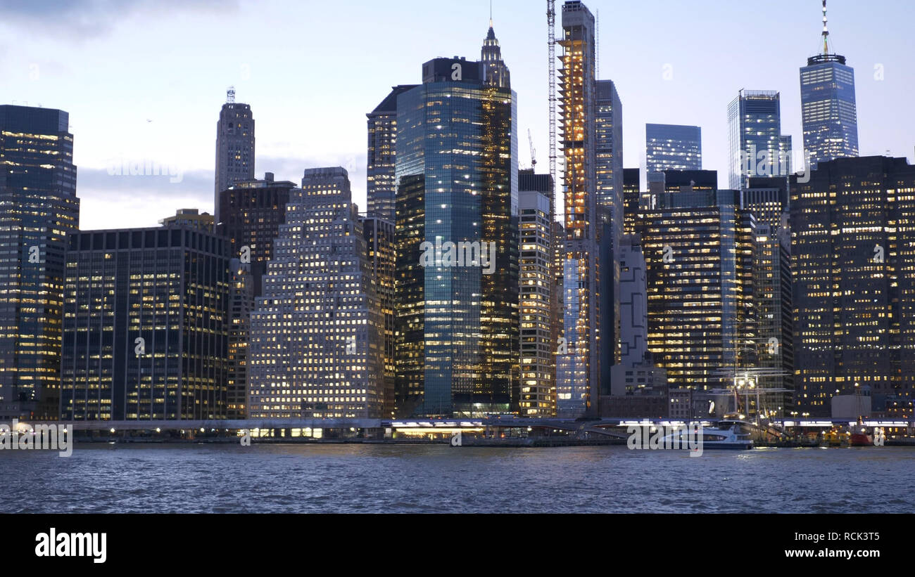 Beautiful Manhattan skyline and New York city lights in the evening ...
