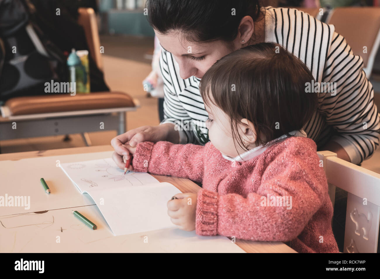 Mother teaching baby to write Stock Photo - Alamy