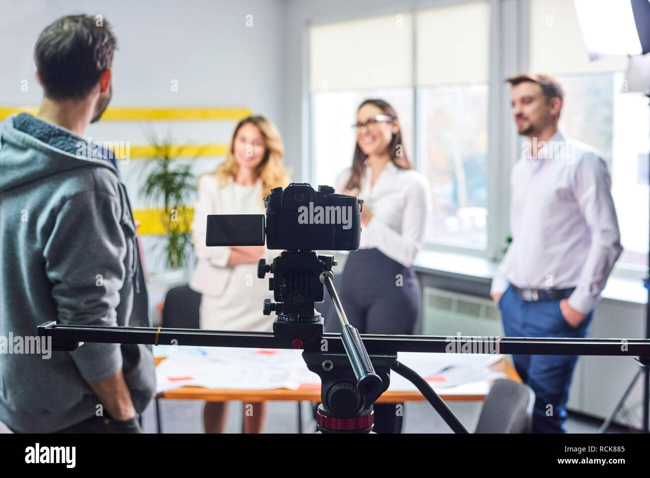 Film director discussing movie plan with the actors in the office scene ...