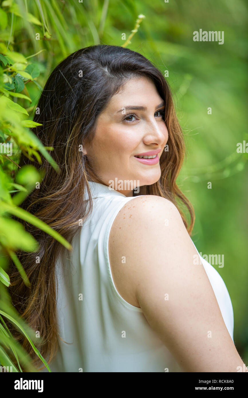 Beautiful woman in the garden Stock Photo - Alamy