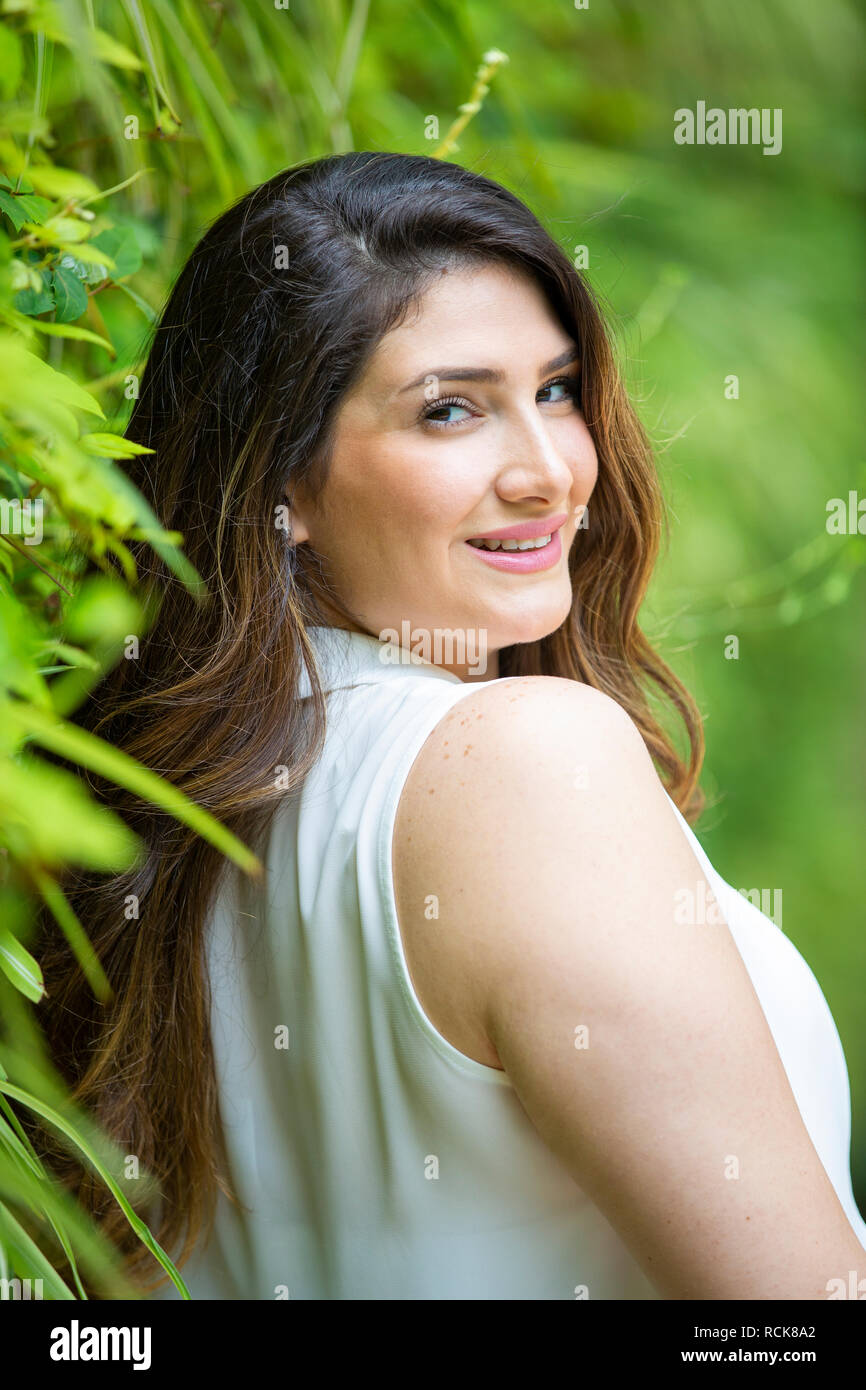 Beautiful woman in the garden Stock Photo - Alamy