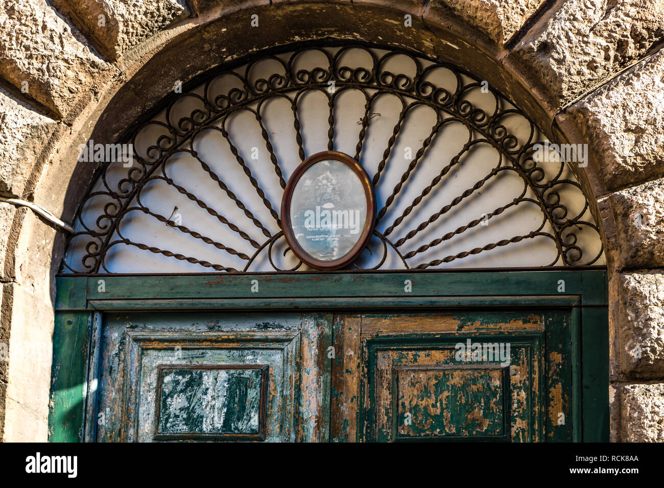ROME, ITALY - JANUARY 2, 2019: light is enlightening the entry door of ...