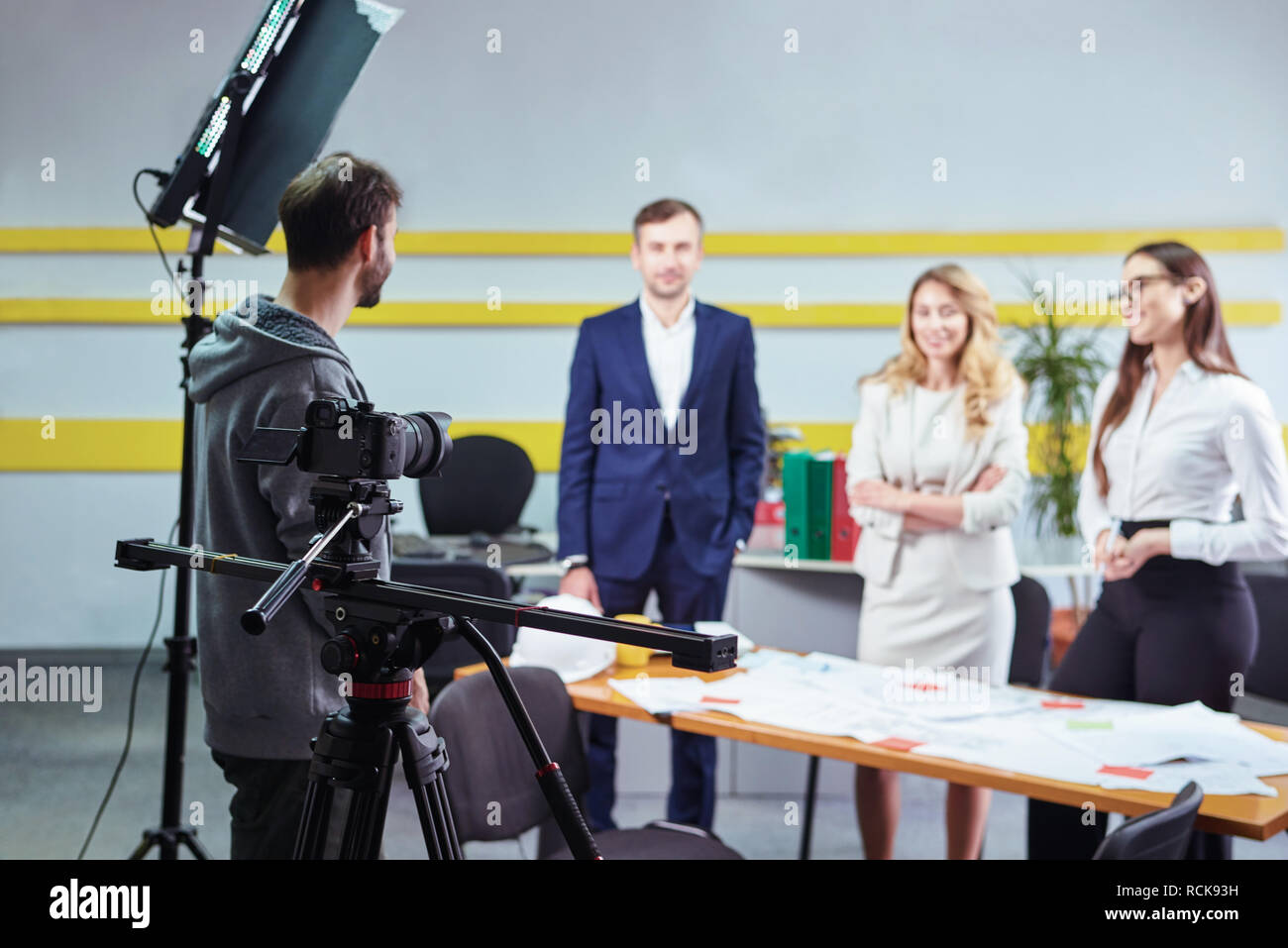 Film director discussing movie plan with the actors in the office scene ...