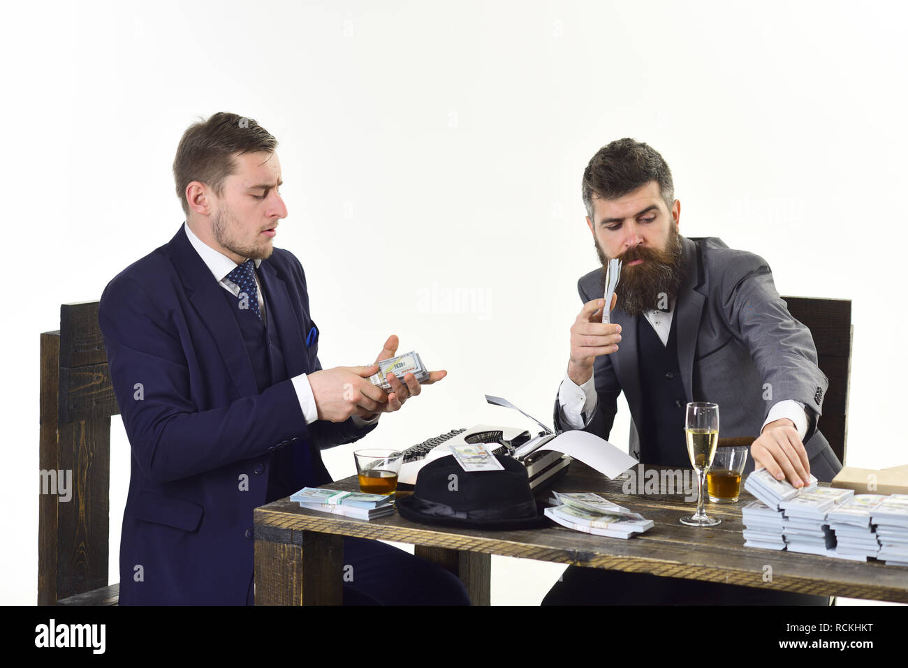 Money is money. Businessmen counting cash money. Busy men planning ...