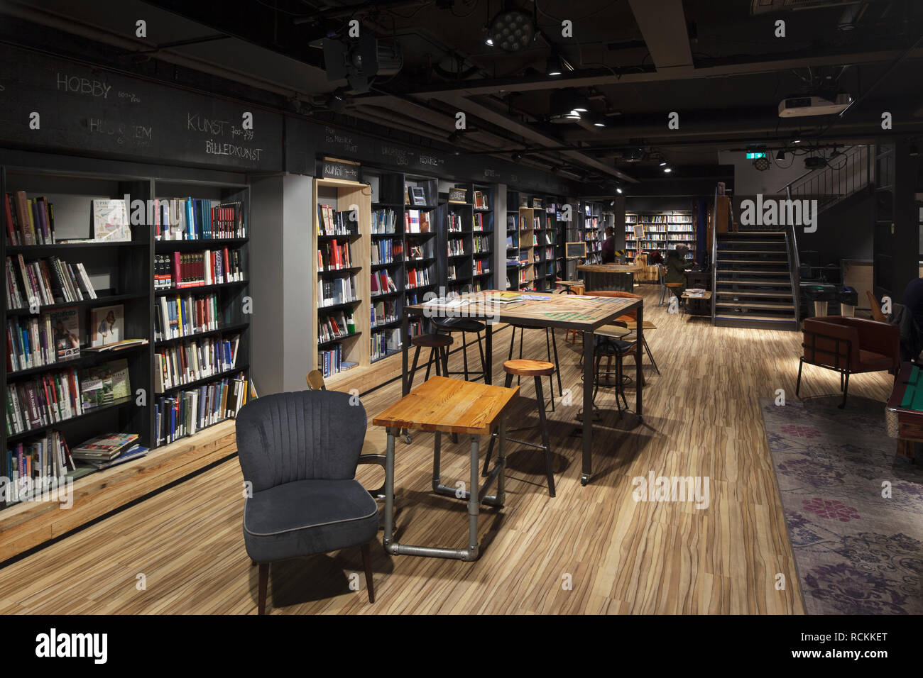 Basement reading room with wooden flooring and bookshelves. Deichman ...