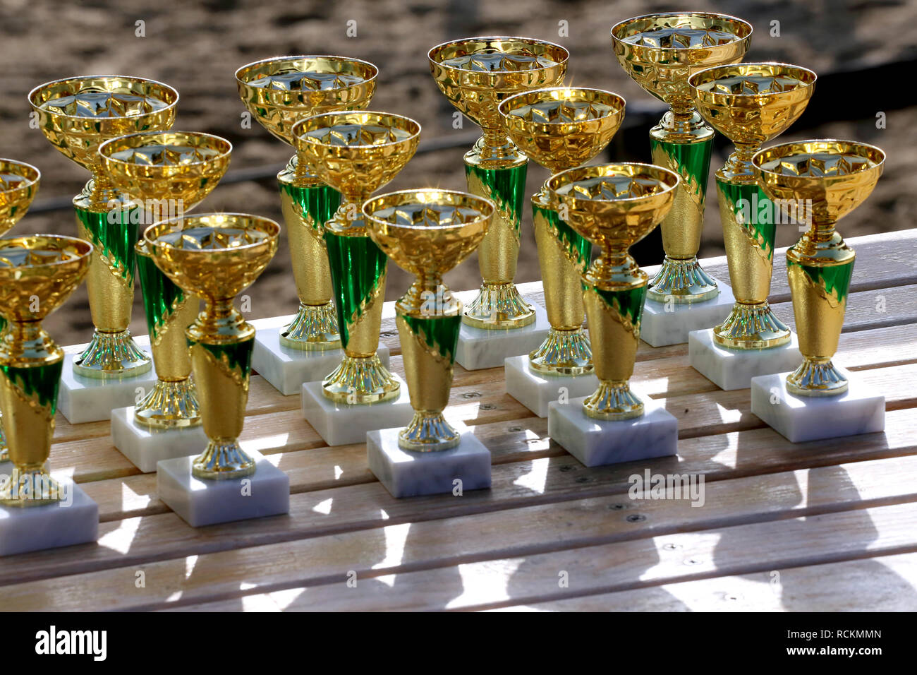 Group of golden trophies championship awards in row outdoors Stock ...