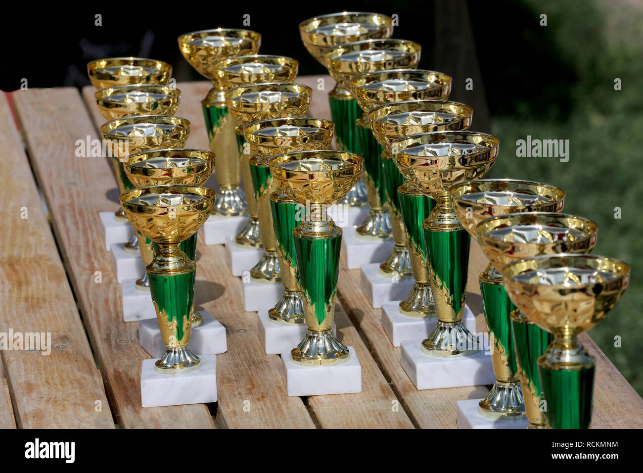 Group of golden trophies championship awards in row outdoors Stock ...