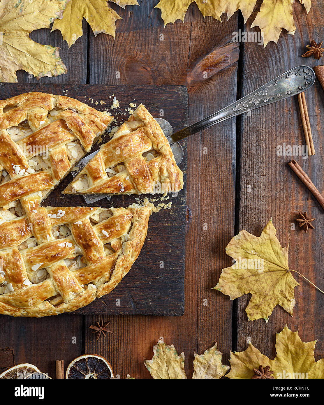round apple pie on a brown wooden board, puff pastry, top view Stock ...