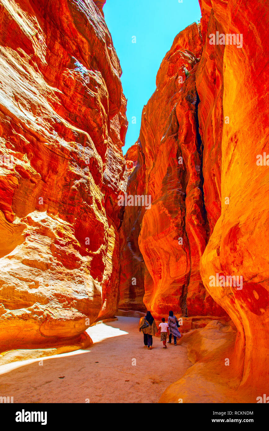 Path between tall rocks in Petra, Jordan Stock Photo - Alamy