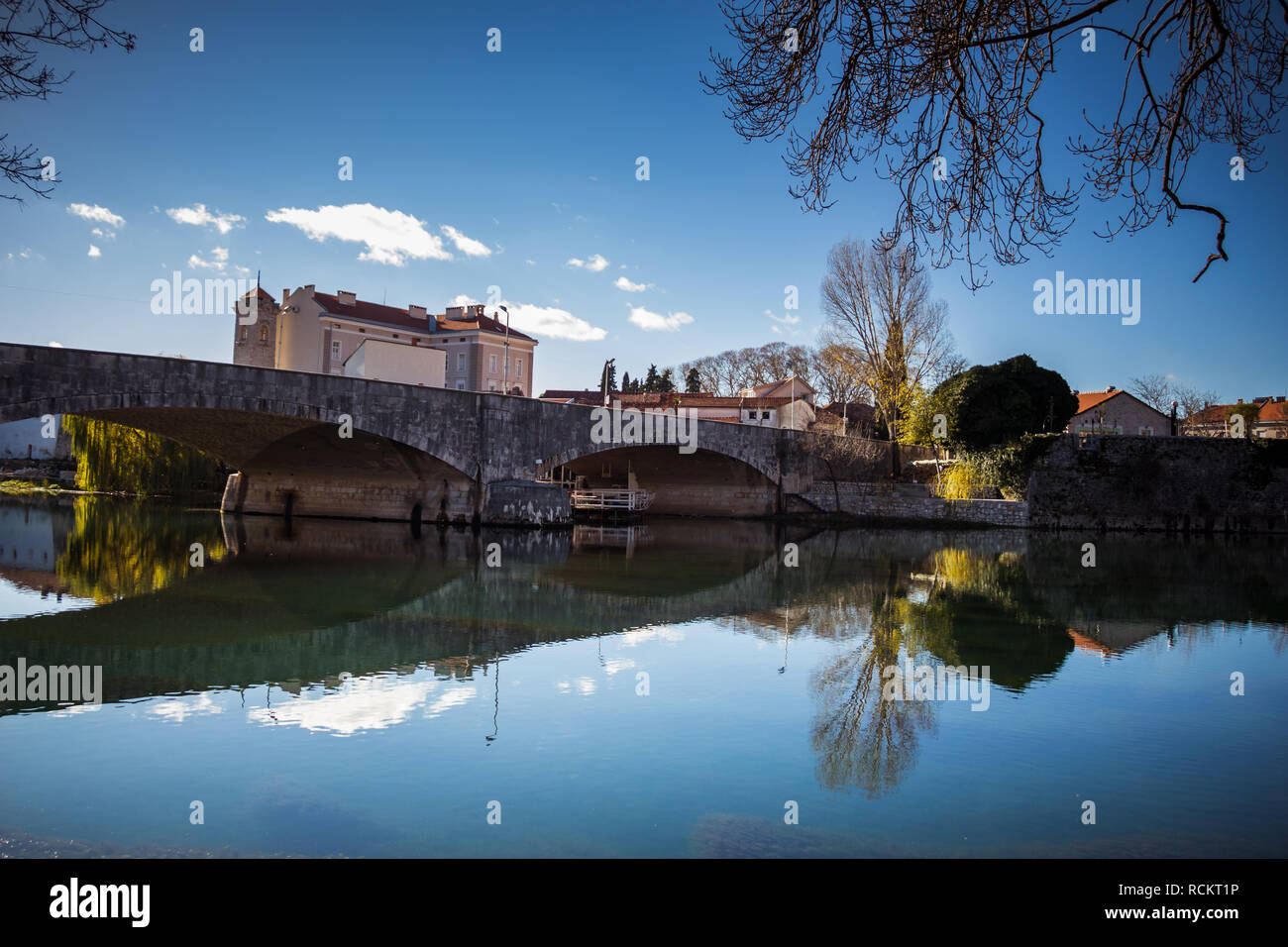 River reflection. Bridge over Trebisnjica river in Trebinje Stock Photo ...