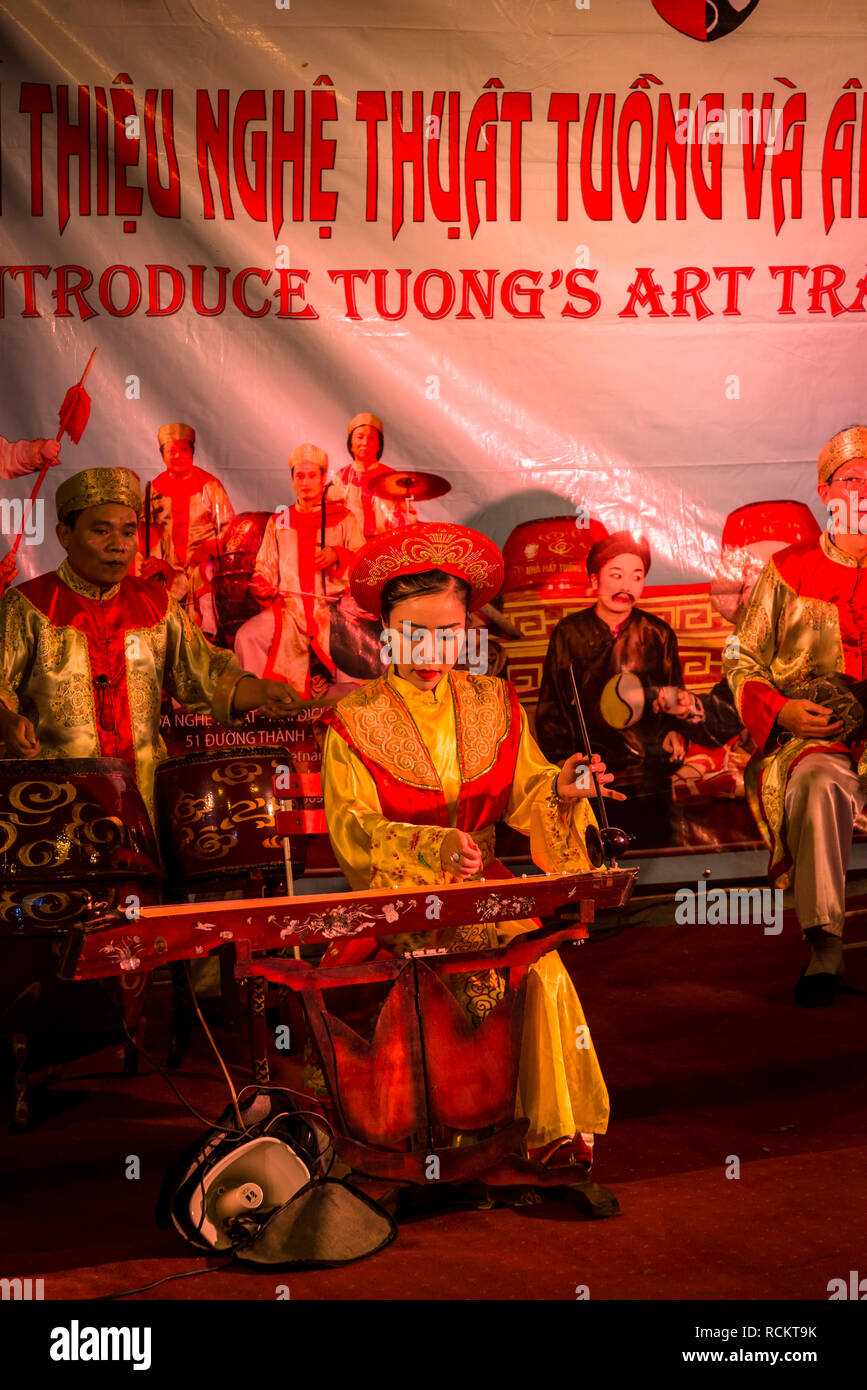 Traditional theatre entertainment in in a street in the Old Quarter ...